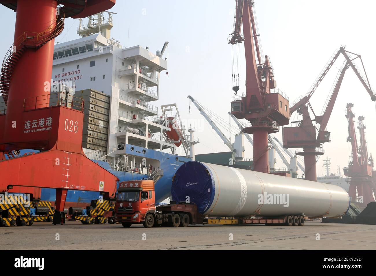 Trucks deliver goods at the Lianyungang Port, which is among the 10 ...