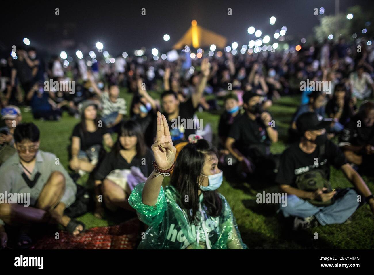 A pro-democracy protester gives the three finger salute during an anti ...