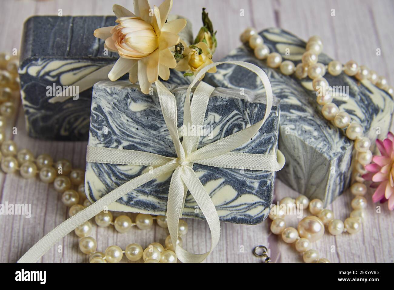 Gray-white handmade soap made from natural ingredients is decorated ...