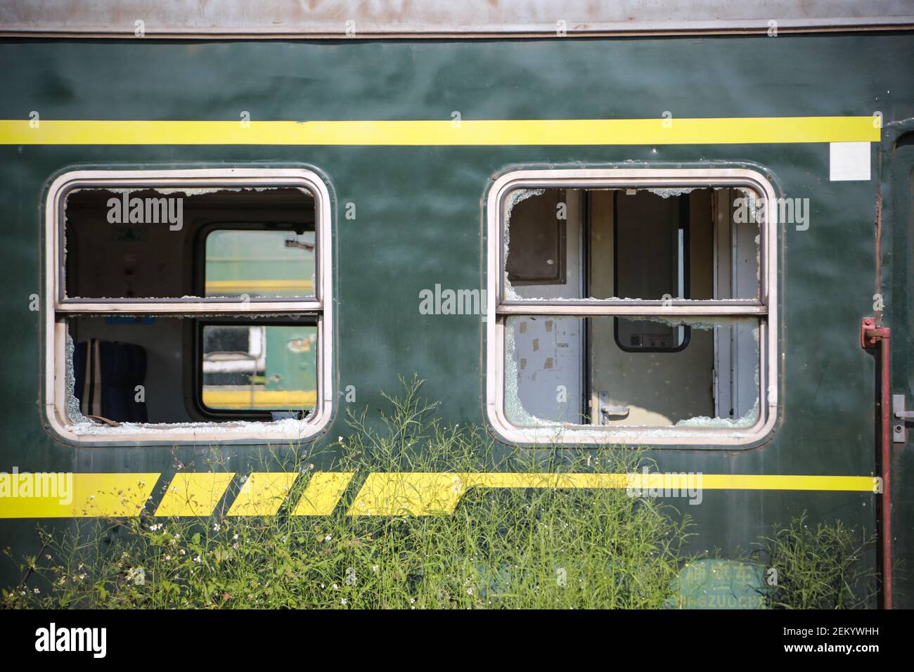 There are piles of abandoned green-skinned trains on the train ...
