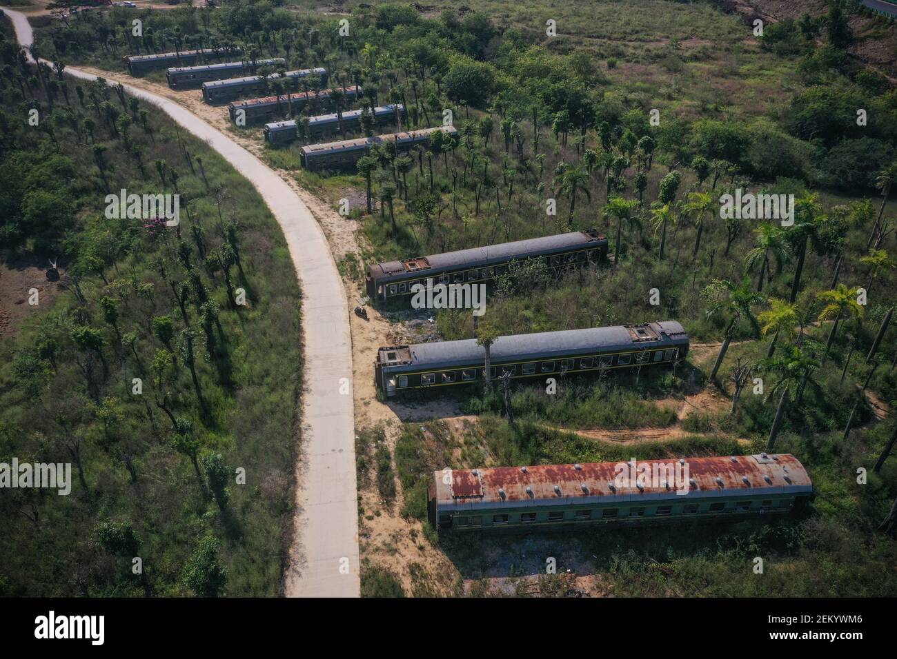 There are piles of abandoned green-skinned trains on the train ...