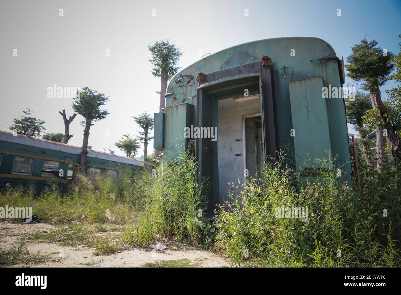 There are piles of abandoned green-skinned trains on the train ...