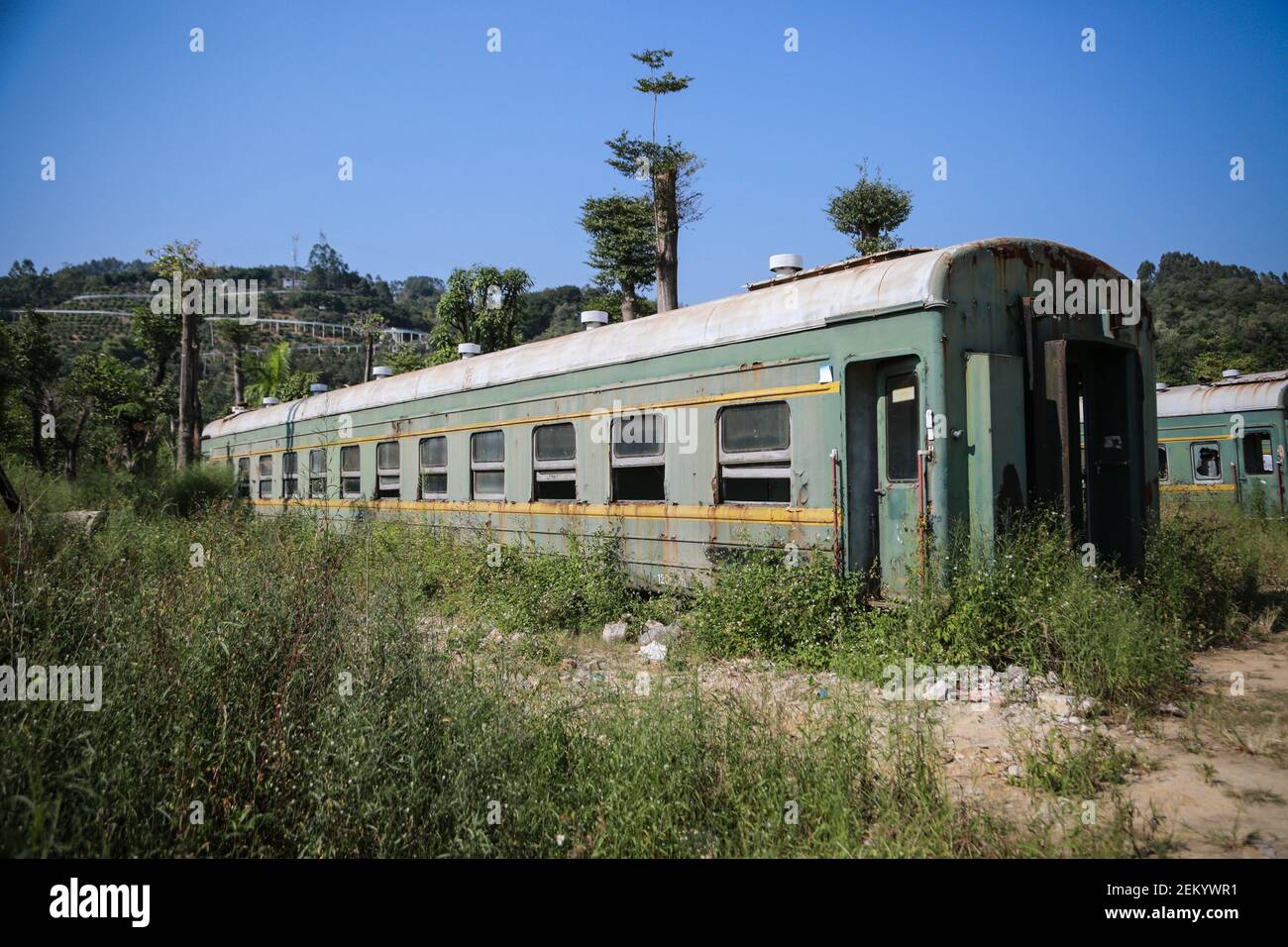 There are piles of abandoned green-skinned trains on the train ...