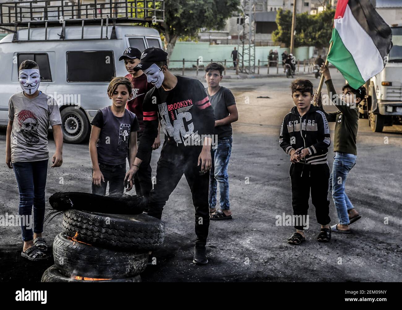 Children burning tires during the commemoration of the first ...
