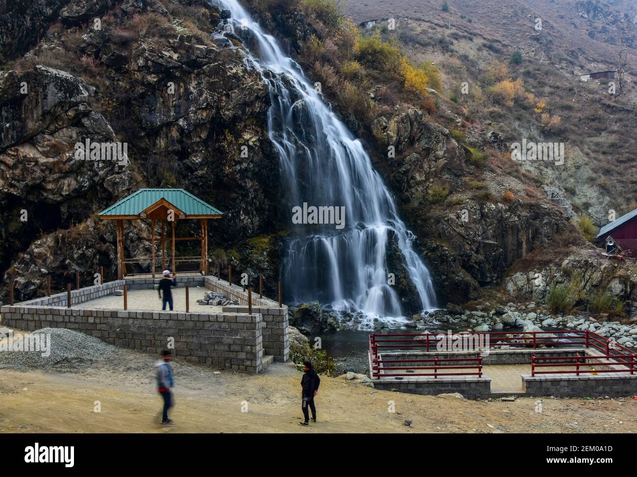 Visitors walk around the waterfalls on an autumn day in Drang about ...