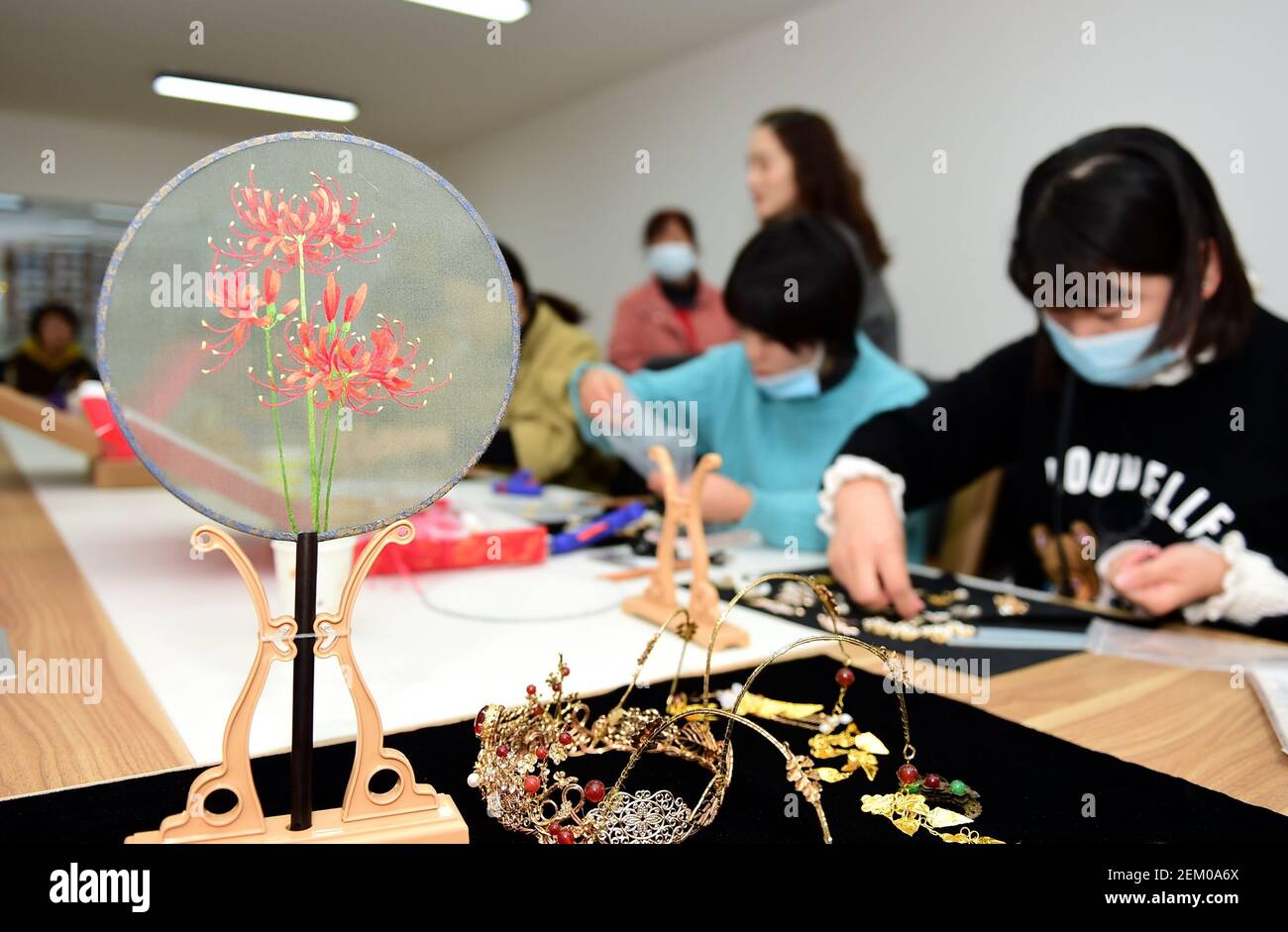 Anhui, CHINA-Female residents learn to make handmade palace fan ...