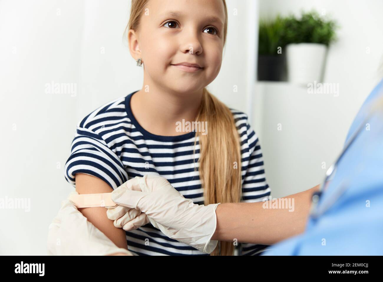 the doctor seals the hand of the child with a plaster close-up Stock ...