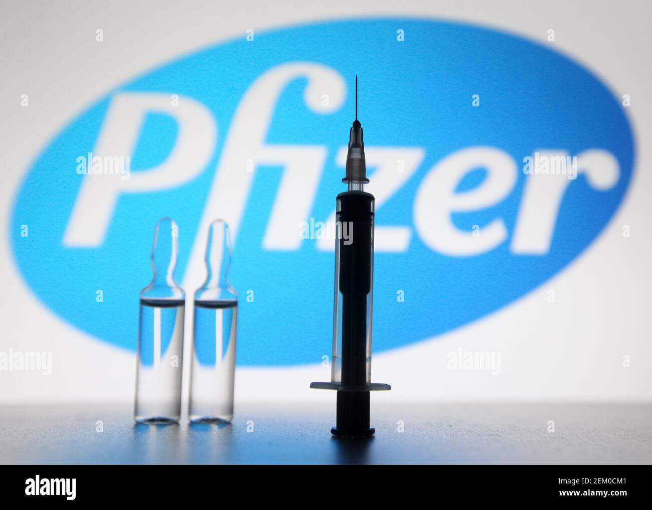 In this photo illustration a syringe and ampules seen in front of ...