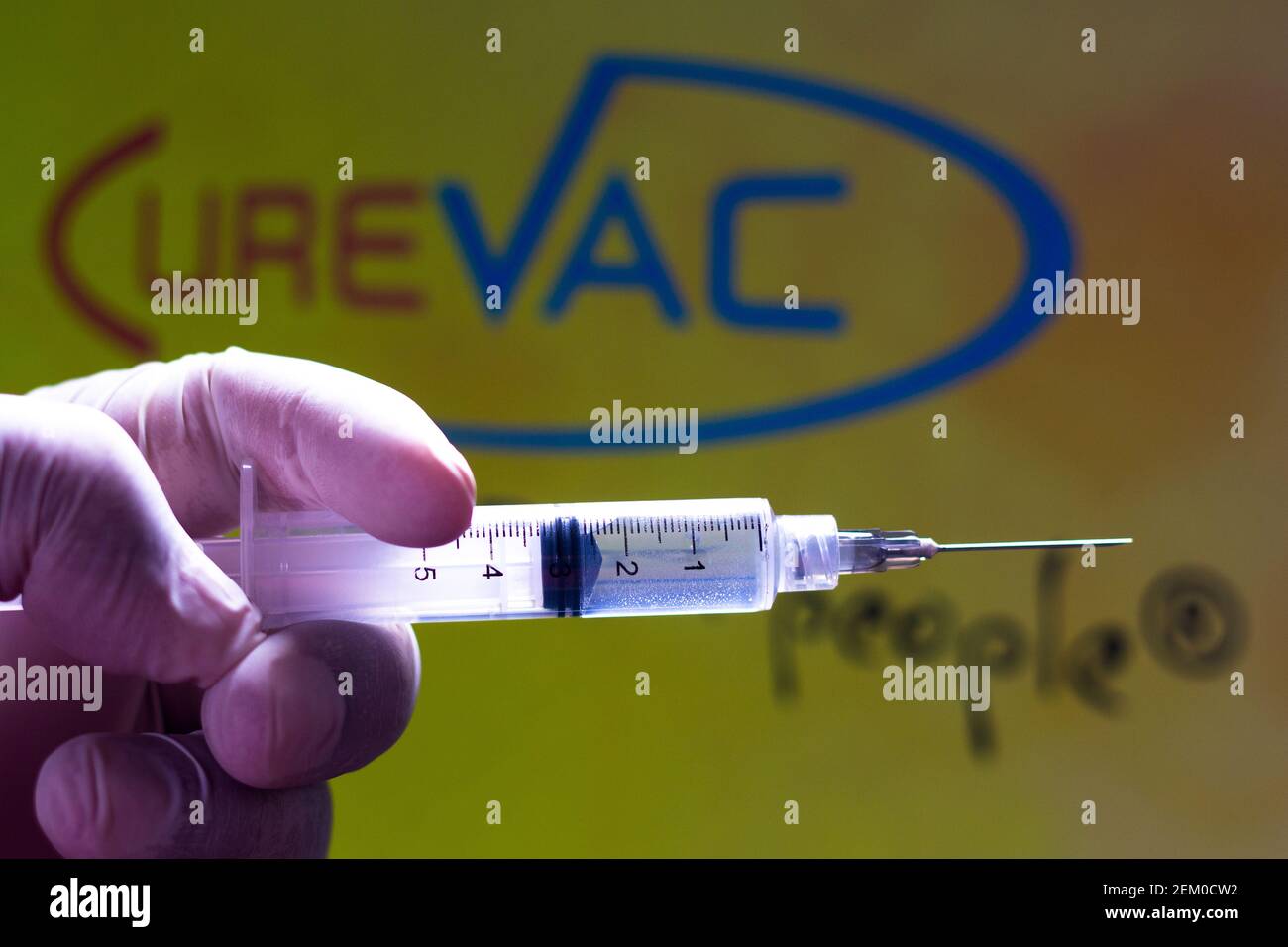 In this photo illustration the medical syringe is seen with CureVac ...