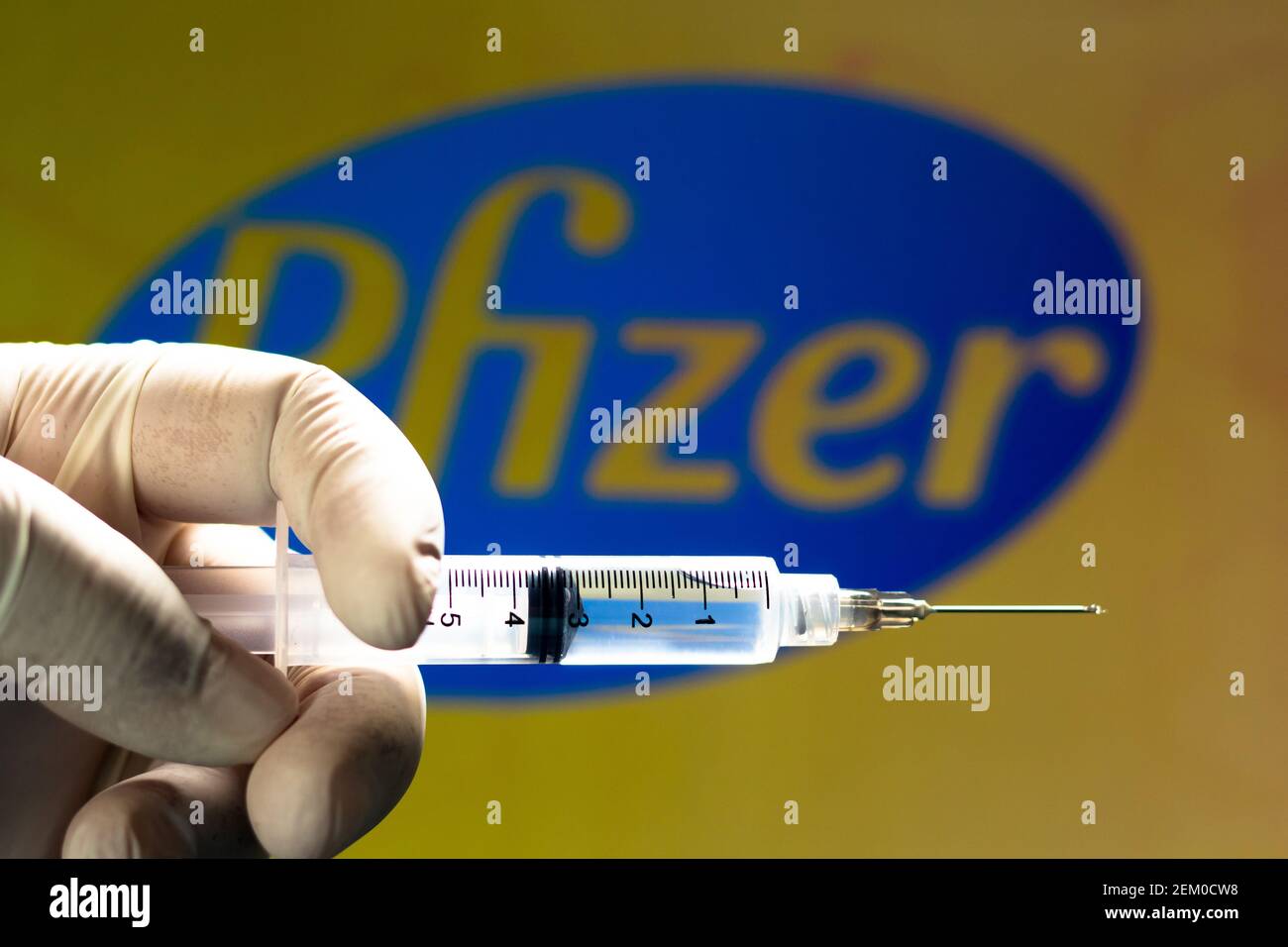 In this photo illustration the medical syringe is seen with Pfizer ...