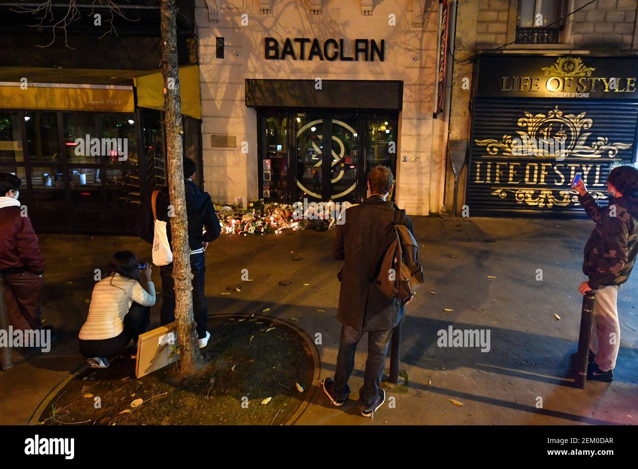 People pay respect outside the Bataclan concert hall in Paris, France ...