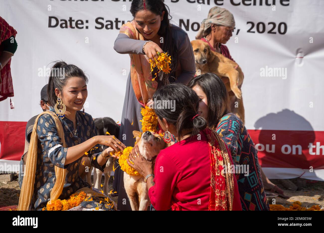 People at a dog care center perform puja on a dog during the Kukkur ...