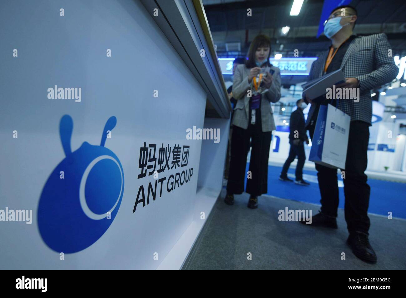 Tourists observe exhibits shown at the 24th China International ...