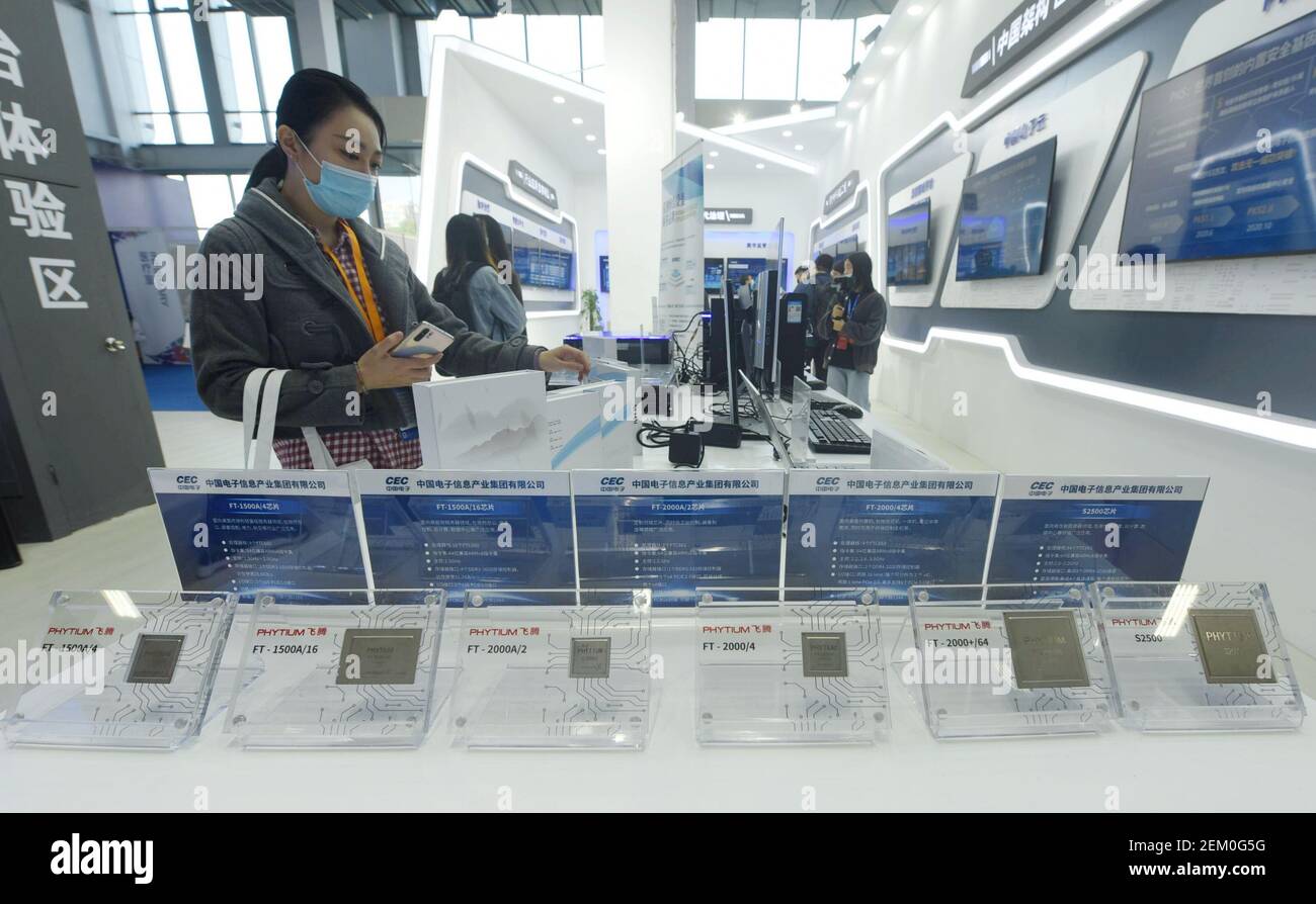 Tourists observe exhibits shown at the 24th China International ...