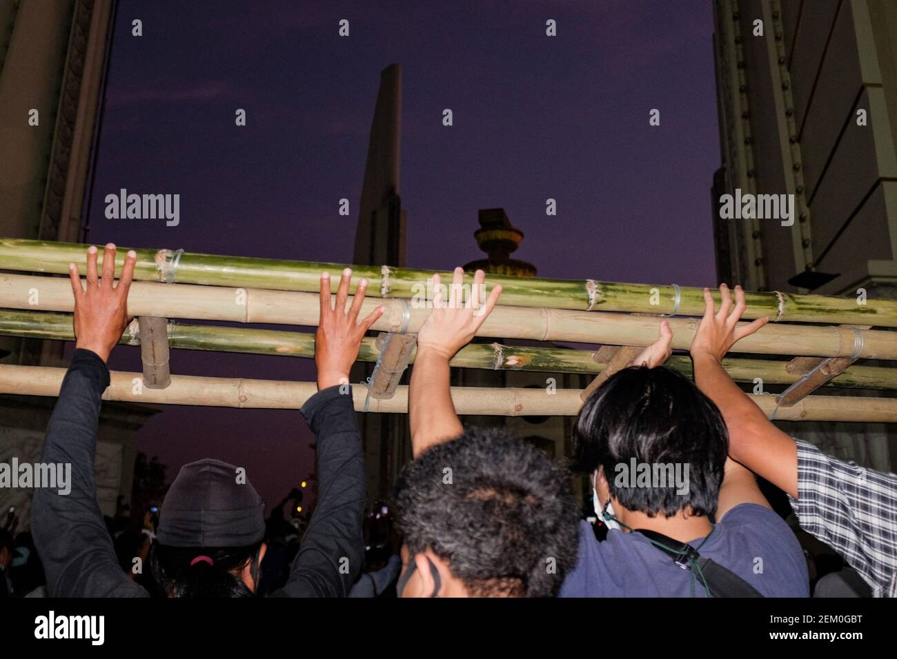 Pro-democracy protesters are seen carrying a ladder to enable them hang ...