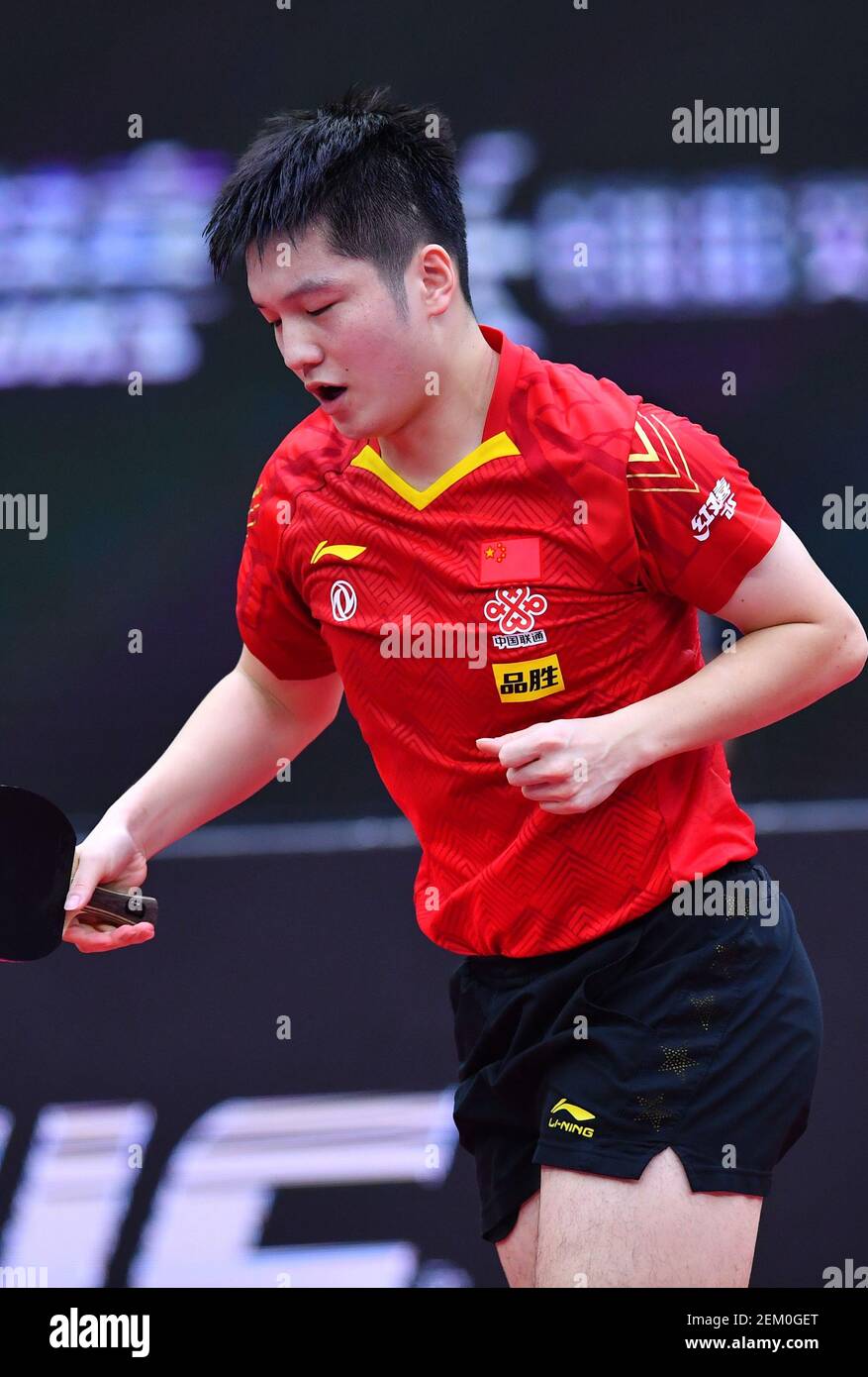 Chinese table tennis player Fan Zhendong plays against South Korean table tennis player Jang ...