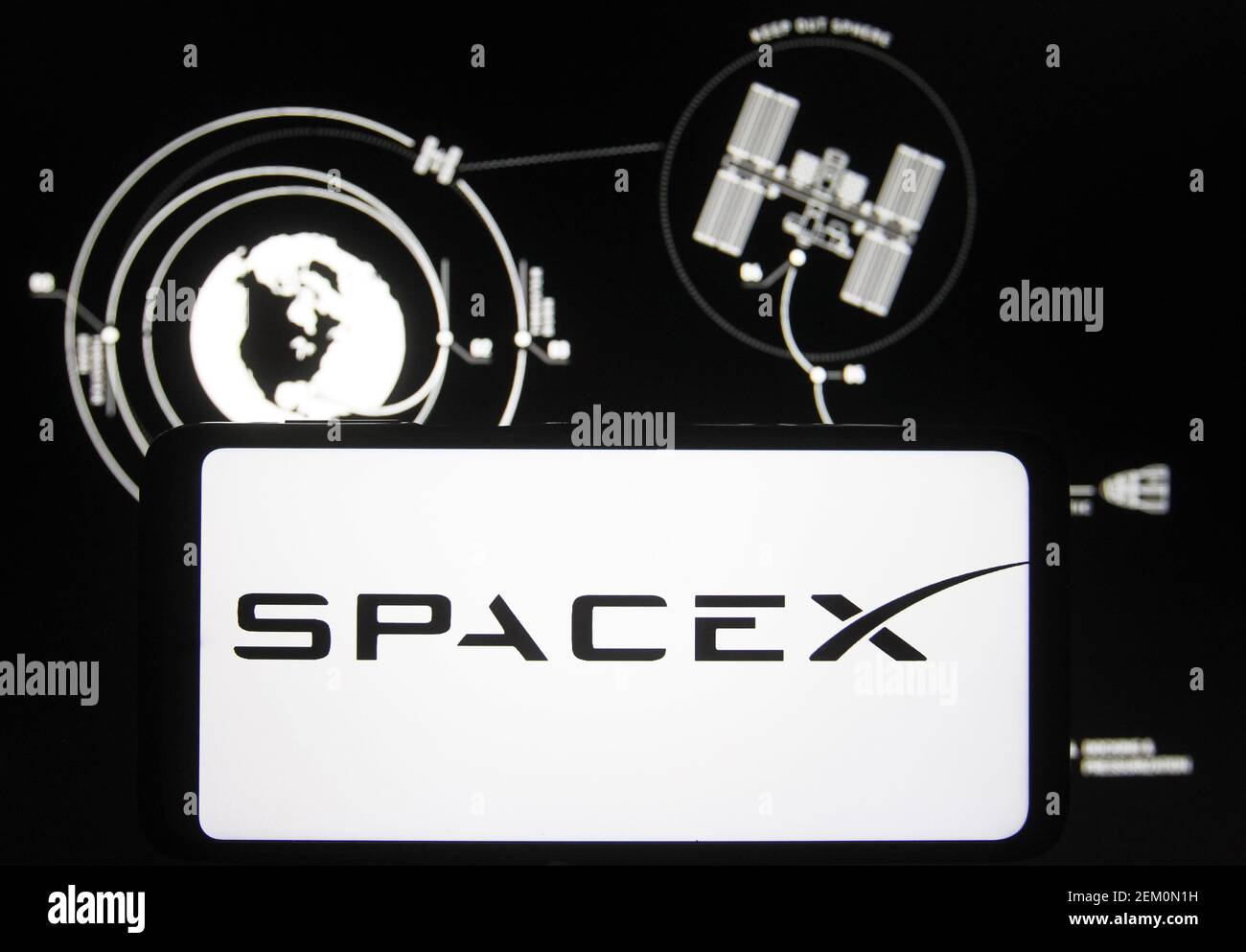 In this photo illustration a SpaceX logo seen displayed on a smartphone ...