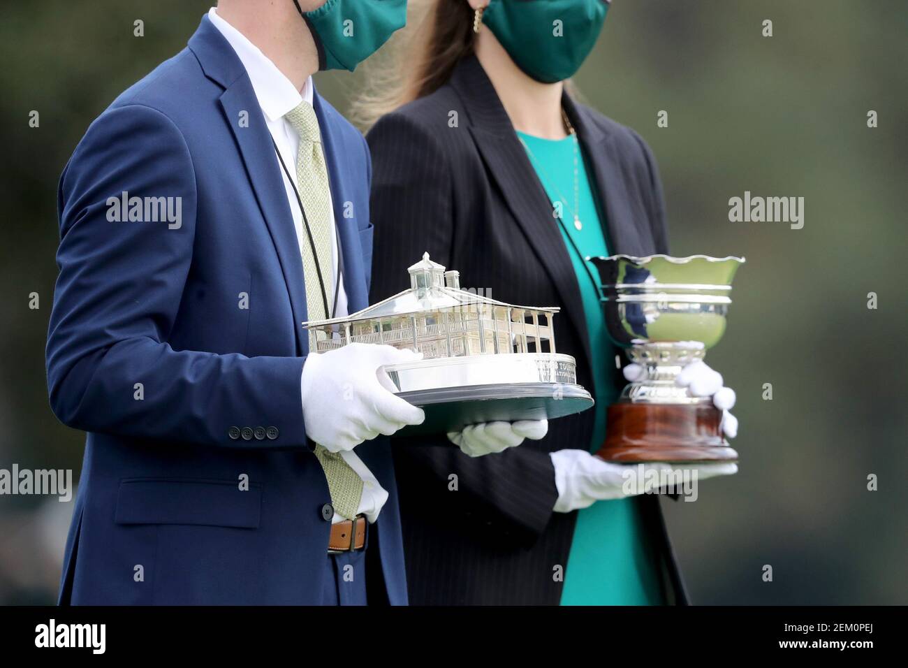 The Masters trophy, left, and the amateur trophy are brought out to be ...