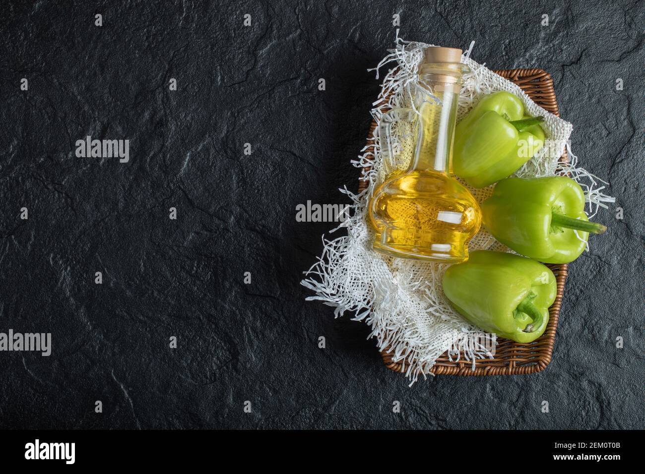Fresh green bell peppers on a dark background Stock Photo - Alamy