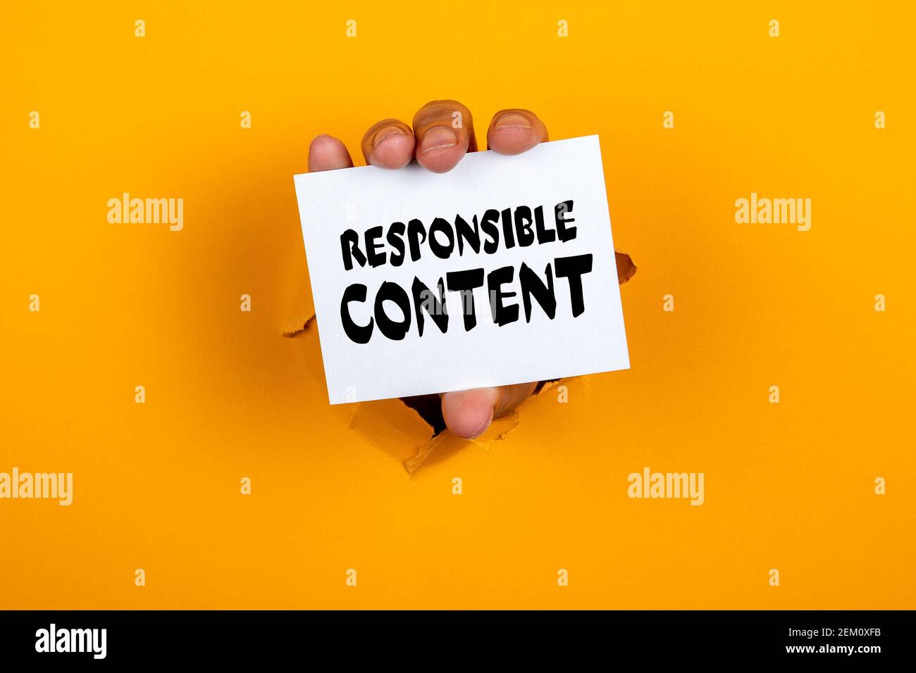 Responsible Content. Note paper in a woman's hand. Yellow background ...