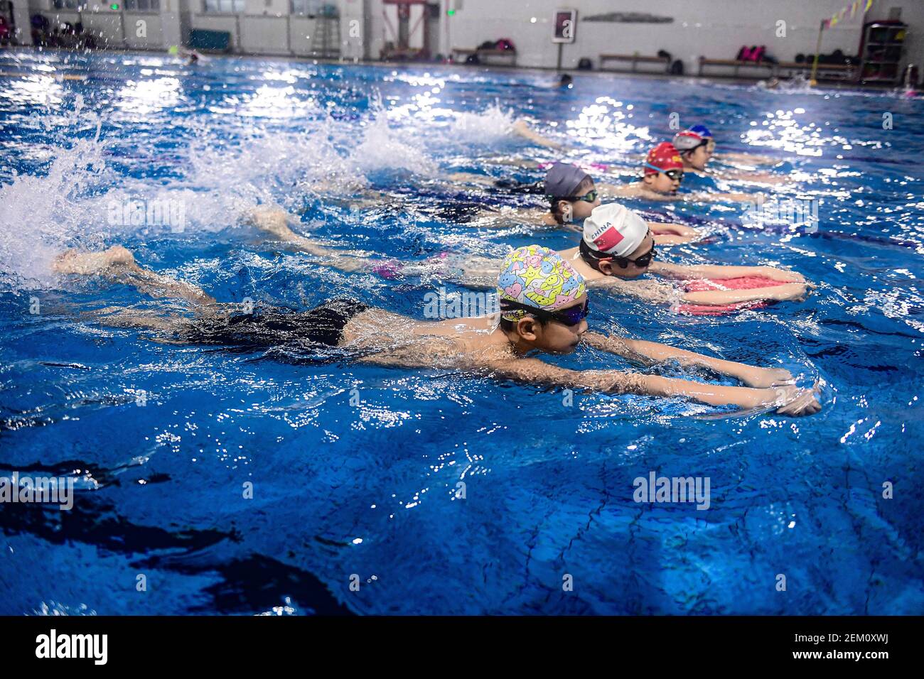 Liaoning, CHINA-Children learn to swim under the guidance of coaches at ...