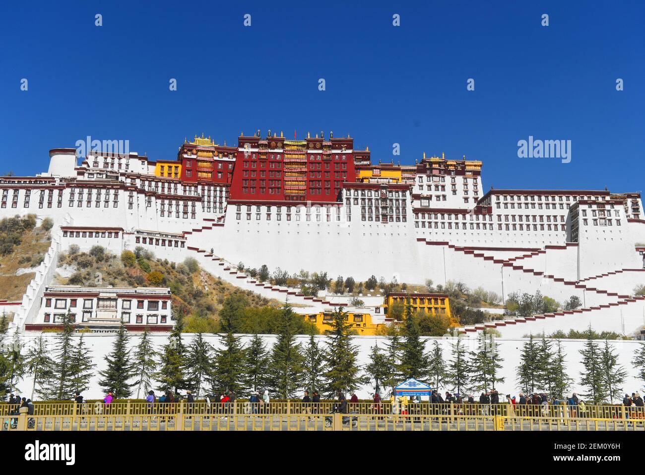 The view of the Potala Palace stands upon a hill in the sunshine in ...