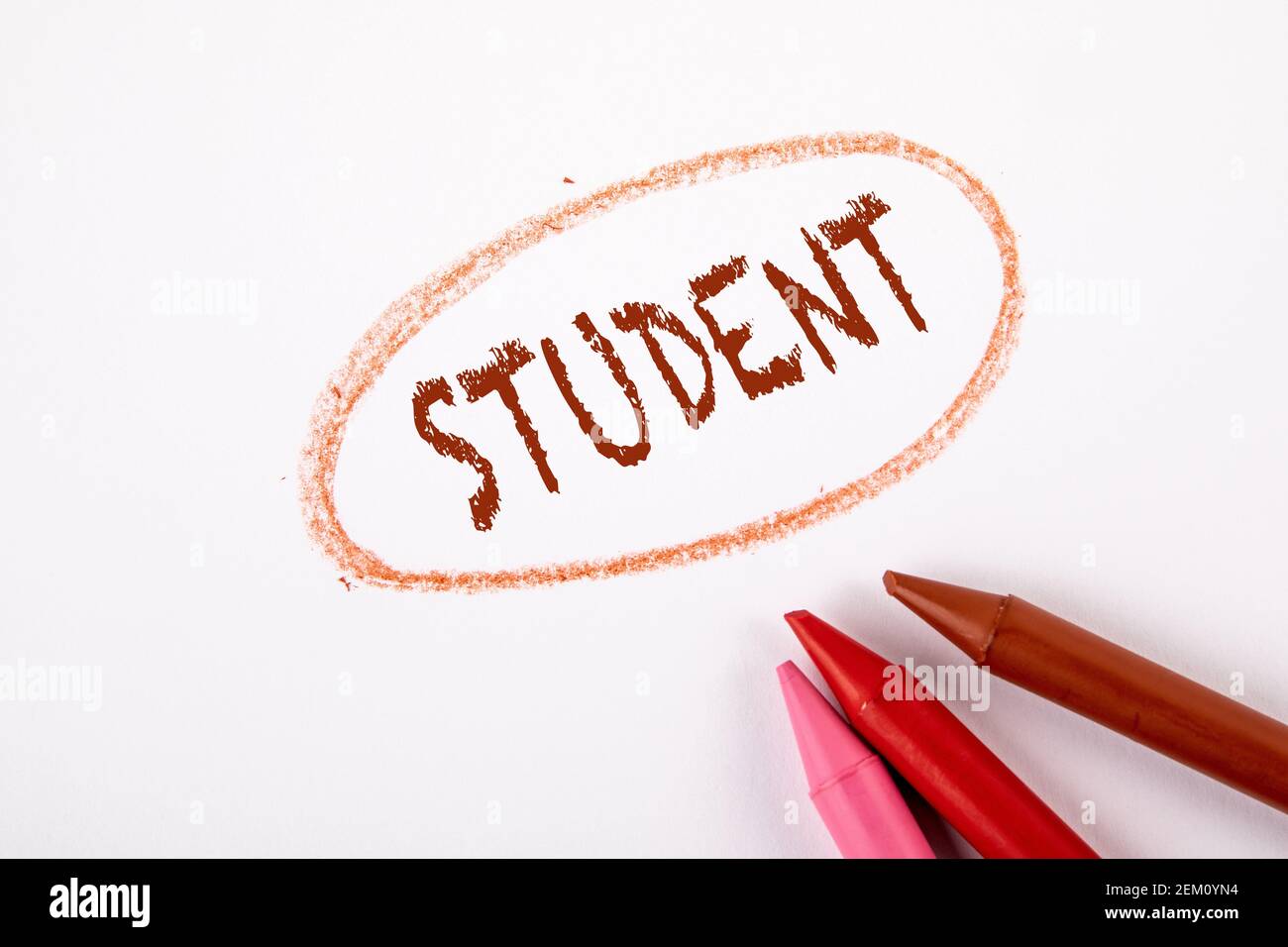 STUDENT. Colored crayons on a white sheet of paper Stock Photo - Alamy