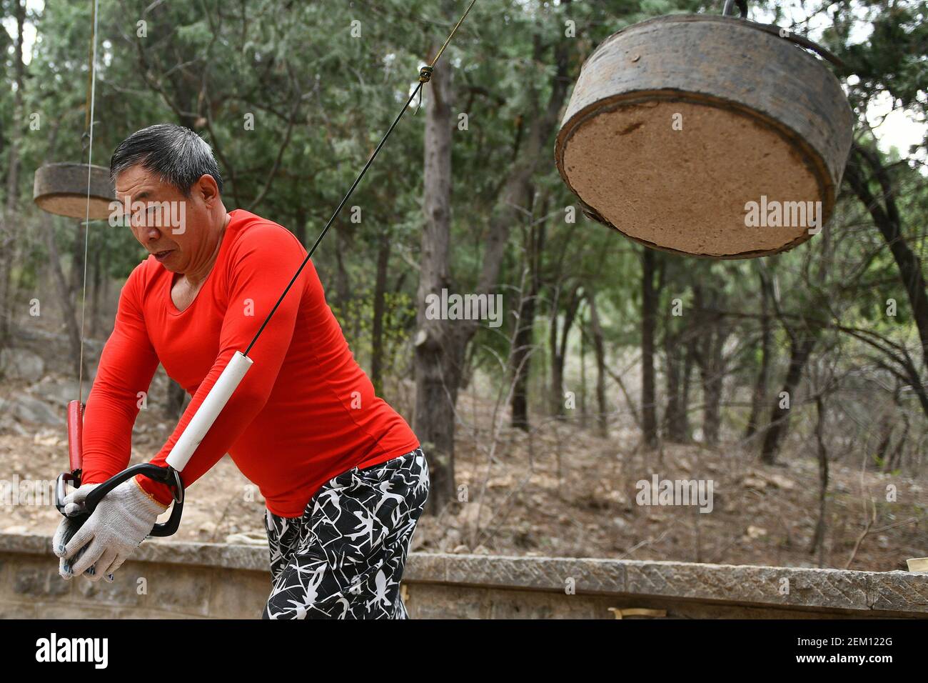 Grandpas exercise in a special "gym" in the forest space of a local ...