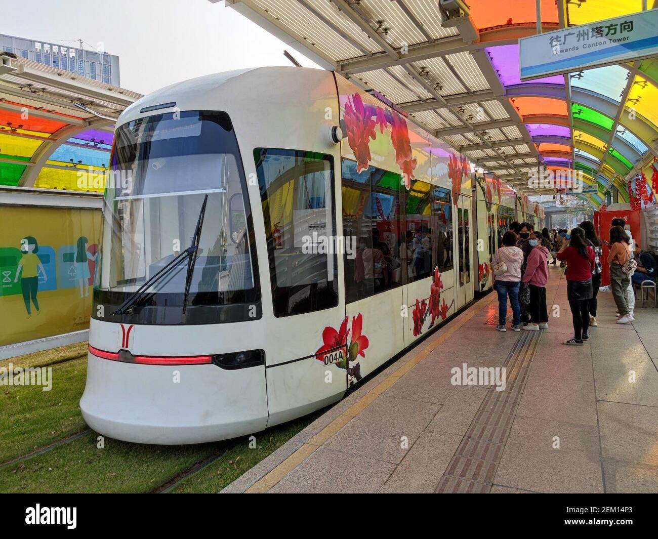 Guangdong, CHINA-A tram runs along the Pearl River in Haizhu District ...
