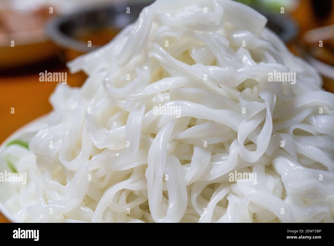 A plate of white Chinese fresh rice noodles, freshly cut hor noodles ...