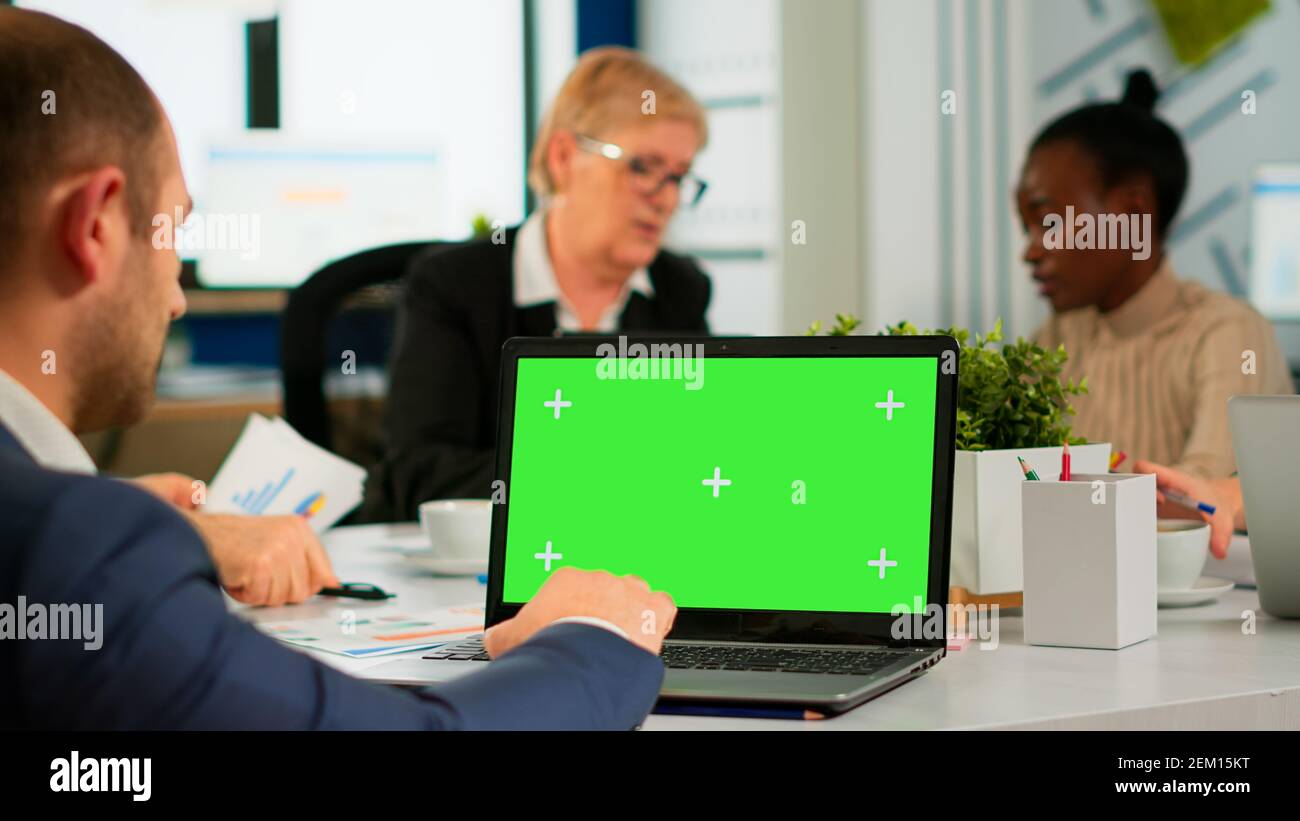 Back view of business man sitting conference desk using laptop with ...