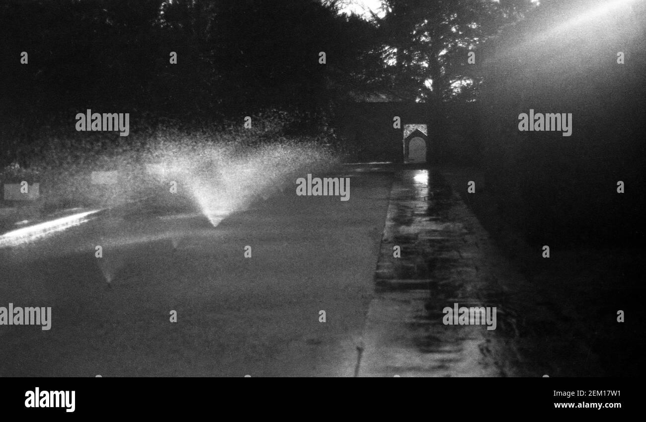 Watering lawn 1970s hi-res stock photography and images - Alamy