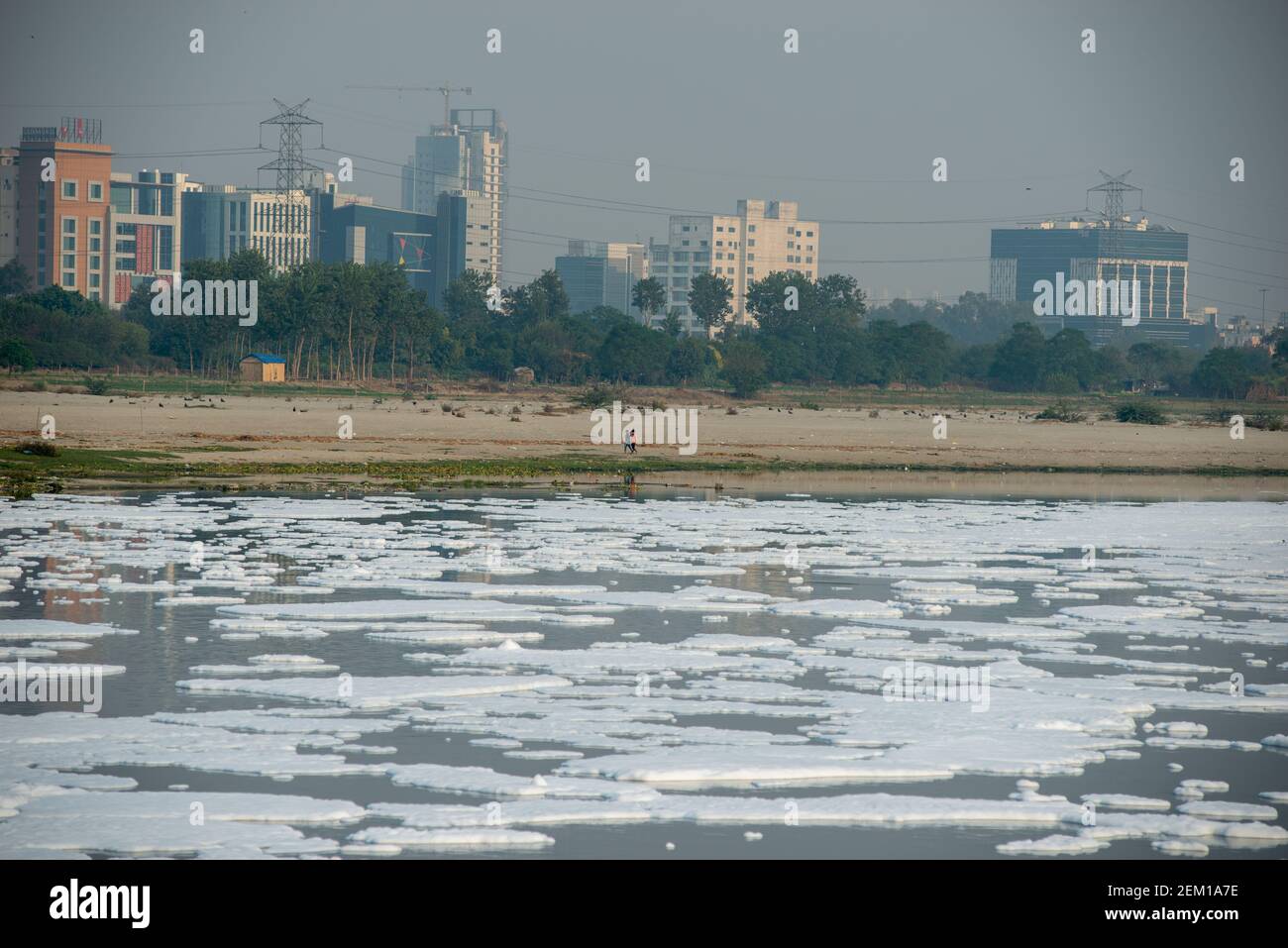 A view of the Yamuna river covered with froth. A thick layer of toxic ...