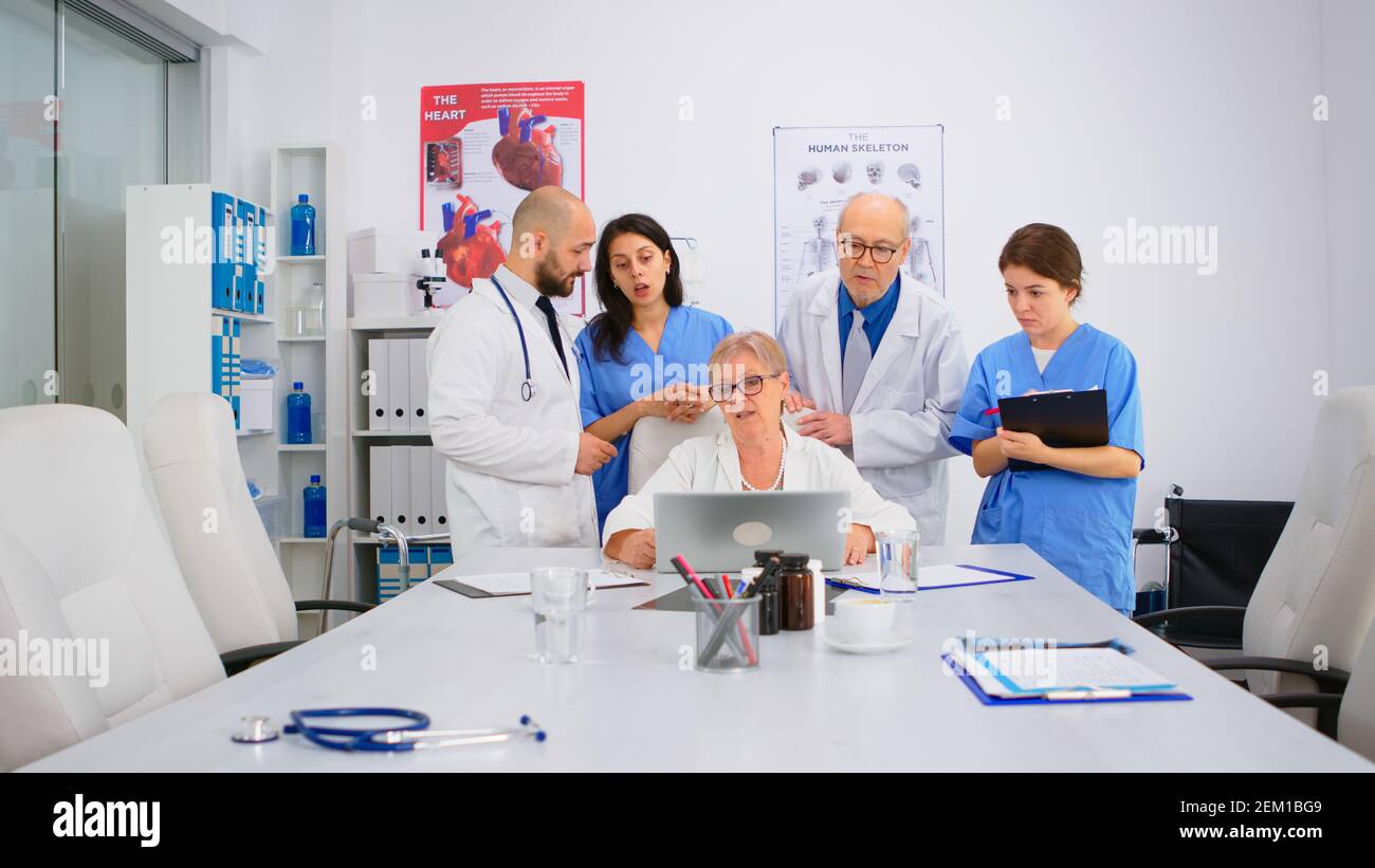 Brainstorming teamwork of physicians solving problem related to ...