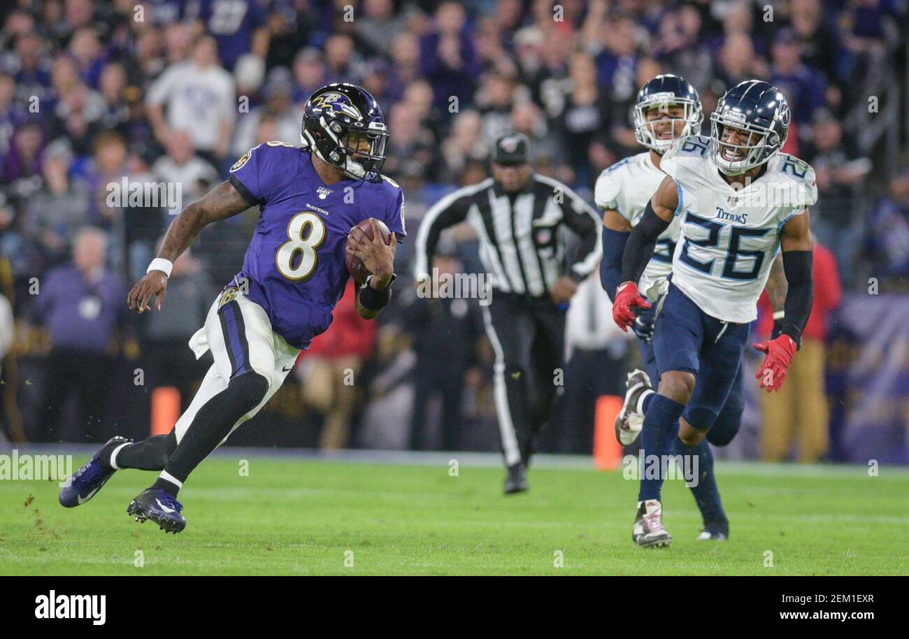 Ravens quarterback Lamar Jackson tries to evade tacklers during last ...