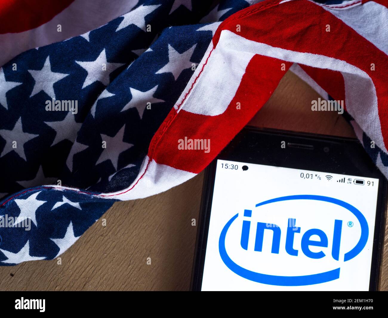 In this photo illustration an Intel logo seen displayed on a smartphone ...