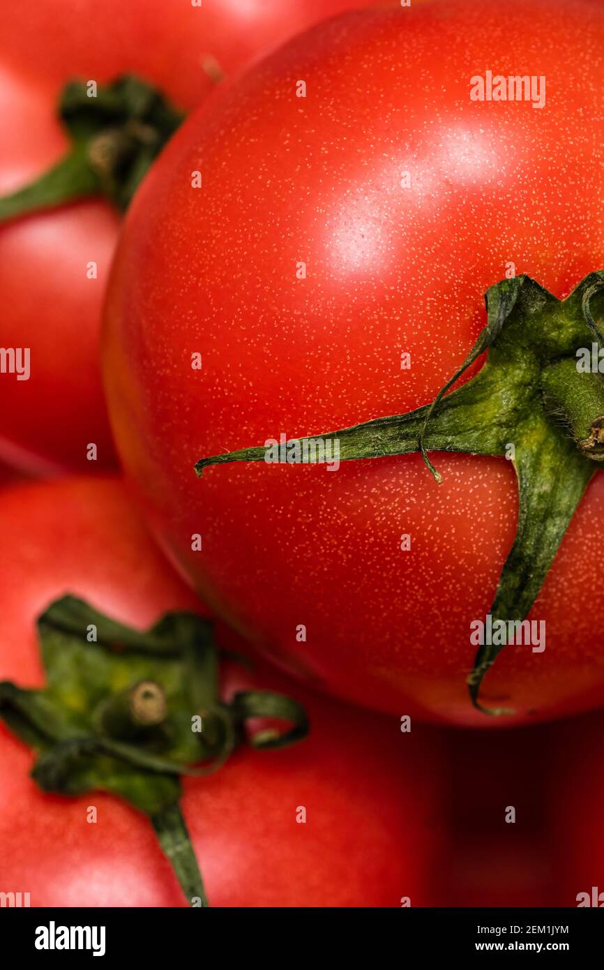 Close up of ripe red tomato, tomatoes background Stock Photo - Alamy