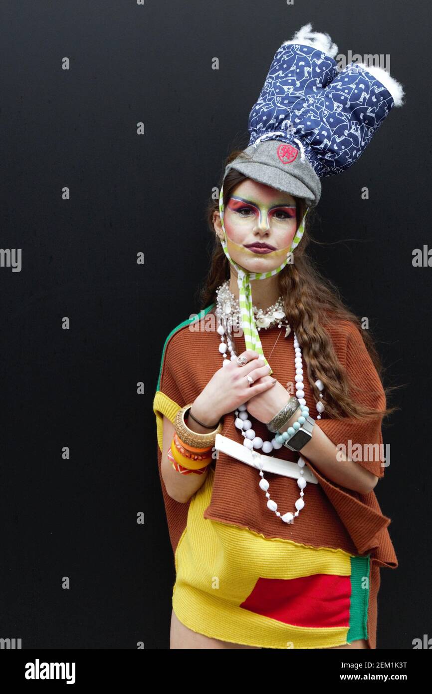 A model showcases Pierre Garroudi’s latest colorful collection at one ...