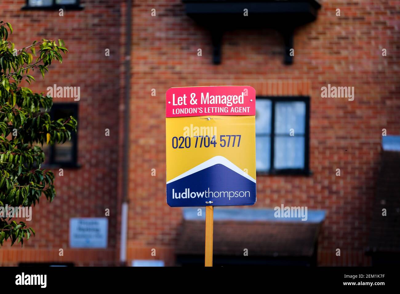 A ‘Let and Managed’ estate agent board sign erected outside a property ...