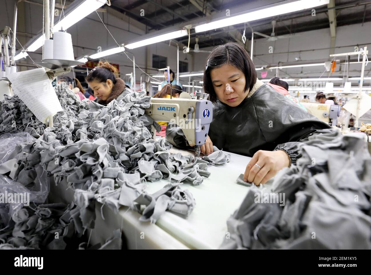 Factory workers make stuffed animals at a production workshop of a toy ...