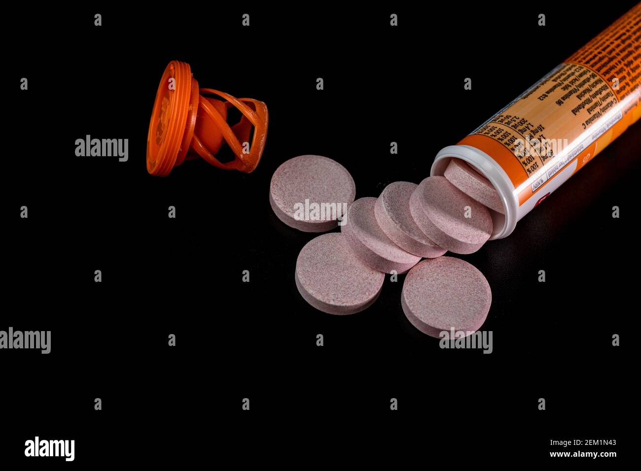 Selective focus on multivitamins effervescent tablets isolated on black ...