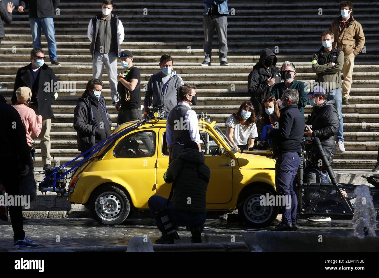 Actor Tom Cruise and actress Hayley Atwell in a Fiat yellow 500 driven ...