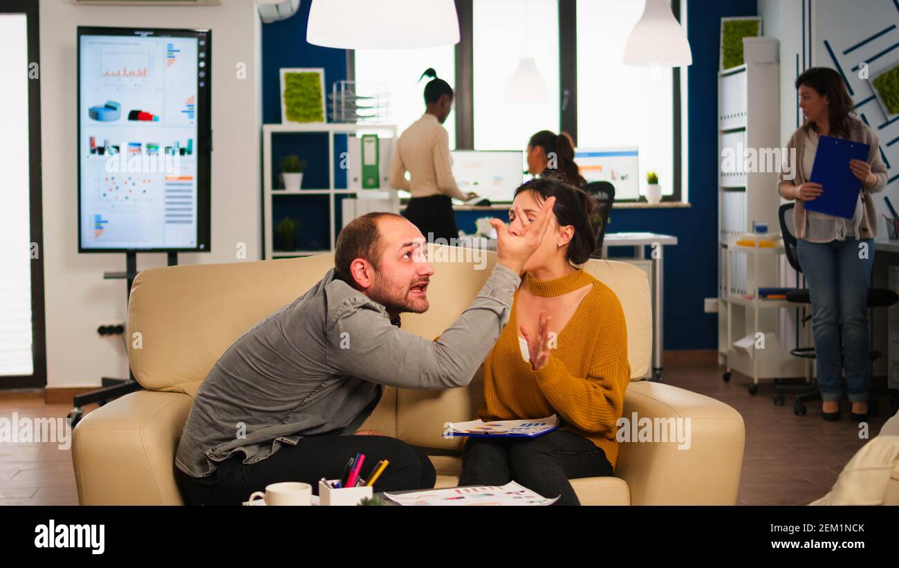 Angry man manager arguing woman employee for bad work result, sitting ...