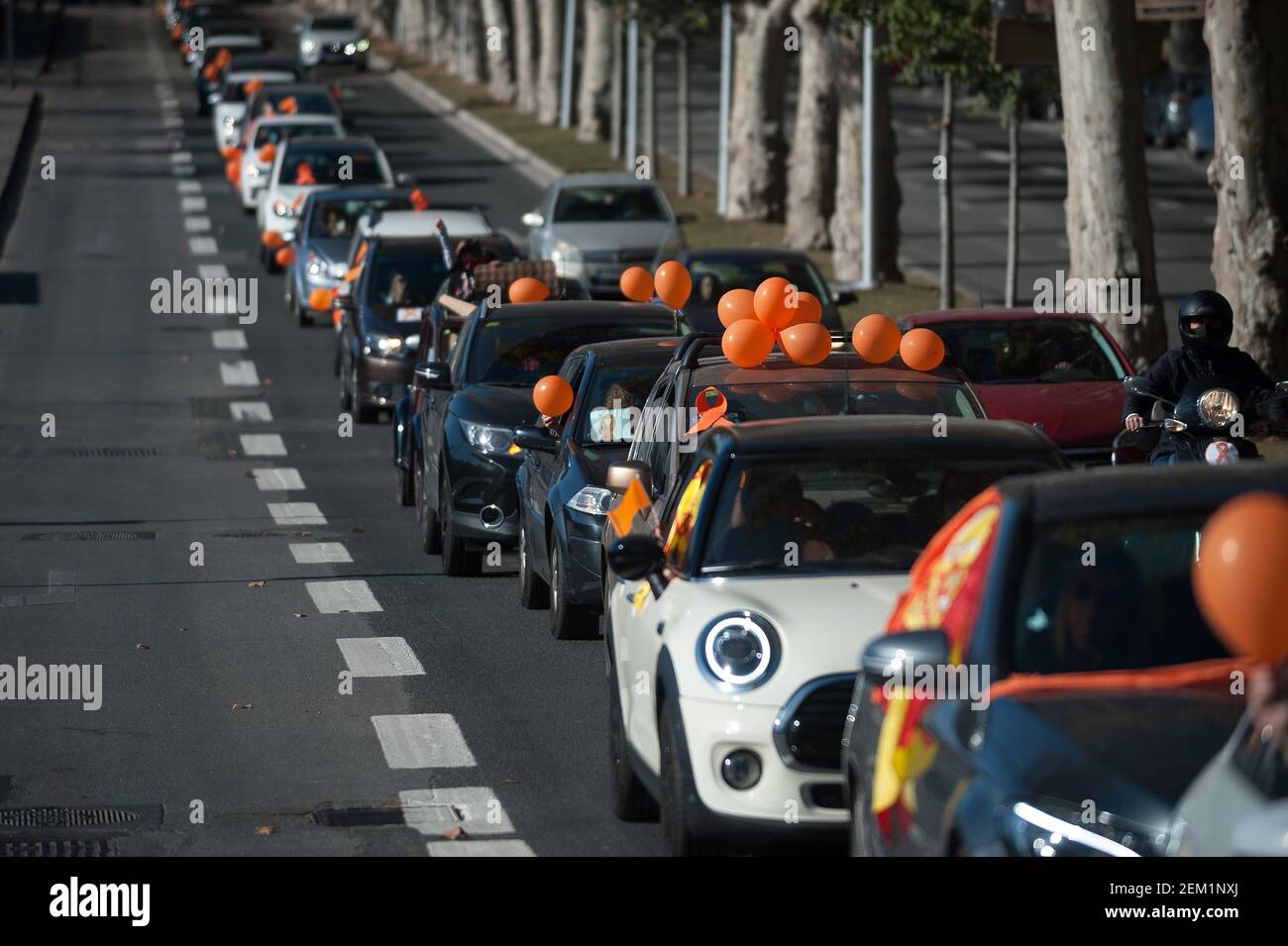 Vehicles decorated with orange balloons and ribbons during the ...