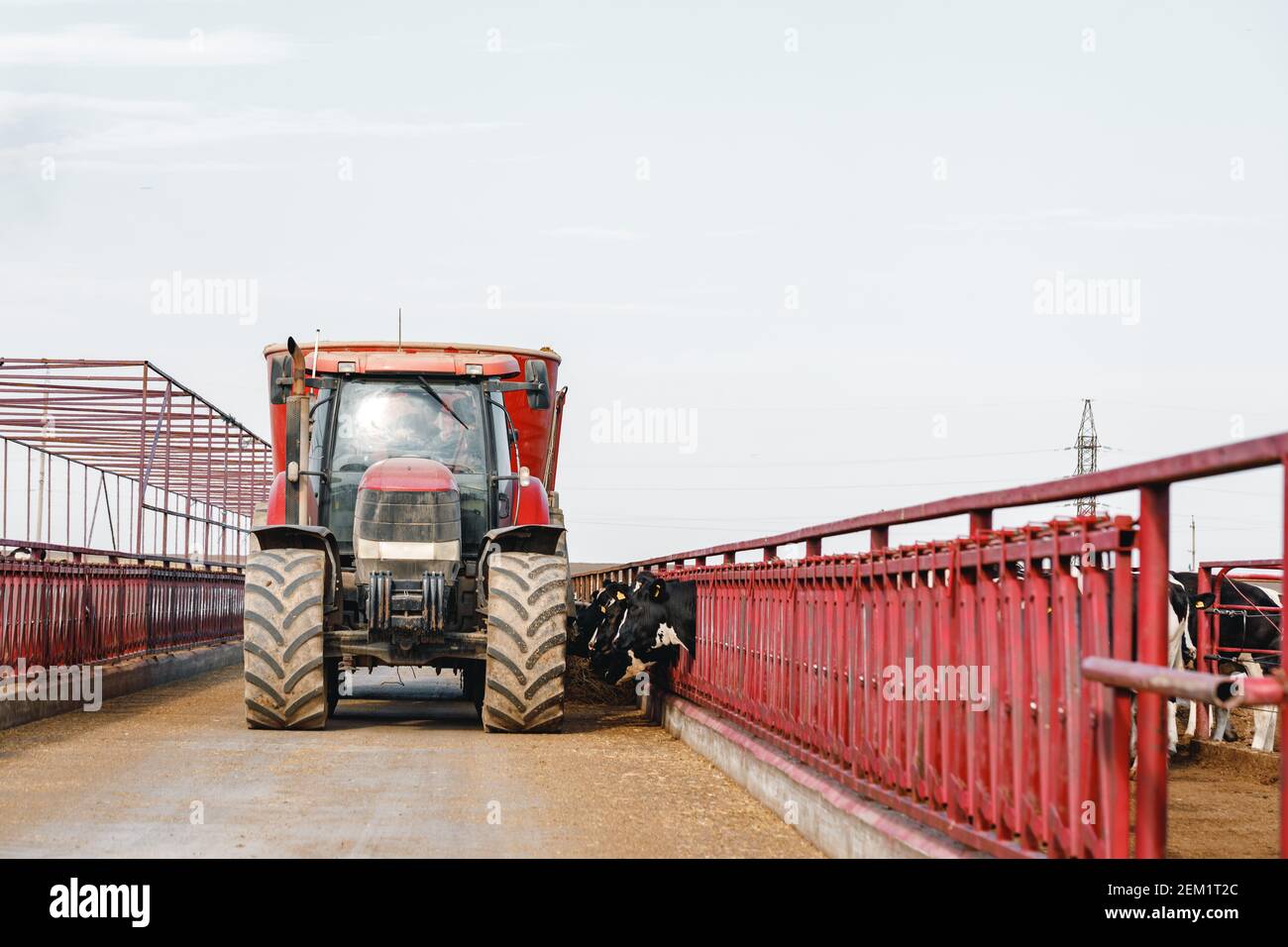 Old agriculture tractor working on a farm Stock Photo - Alamy