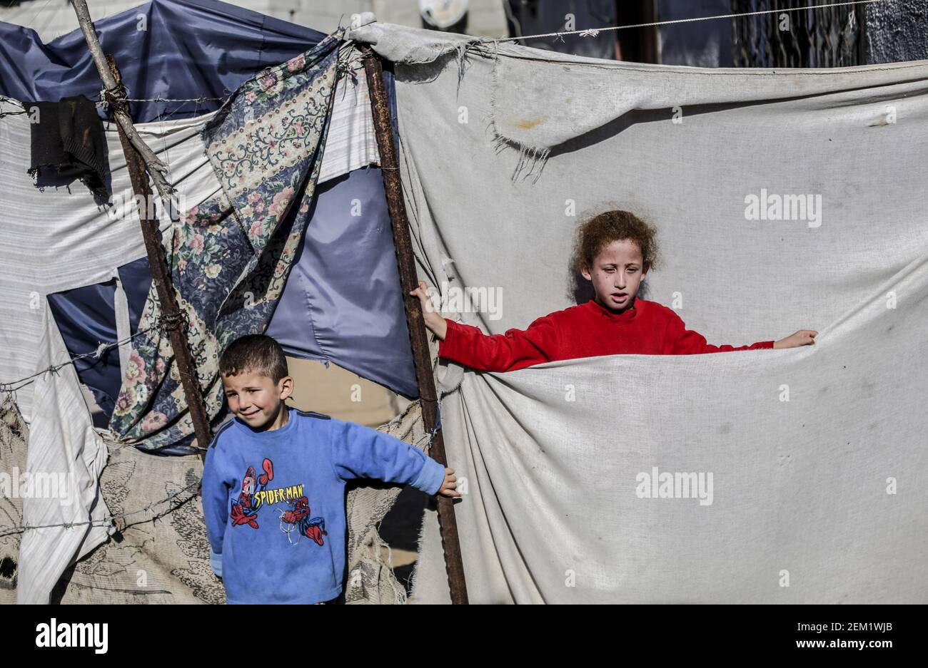 Palestinian children play outside their home in the northern Gaza Strip ...