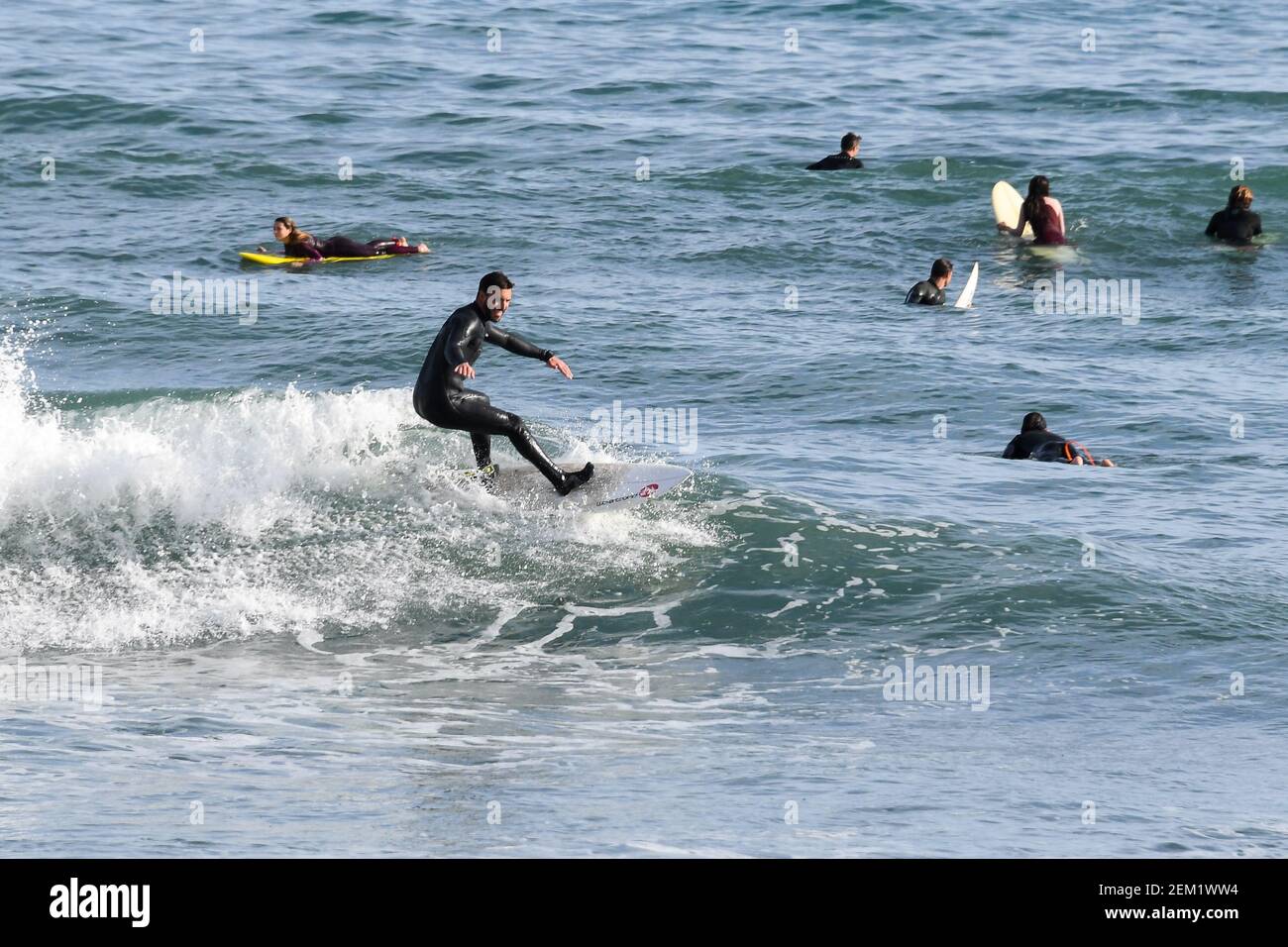 Surfers on the beach of moure rouge in Cannes, France on November 21 ...