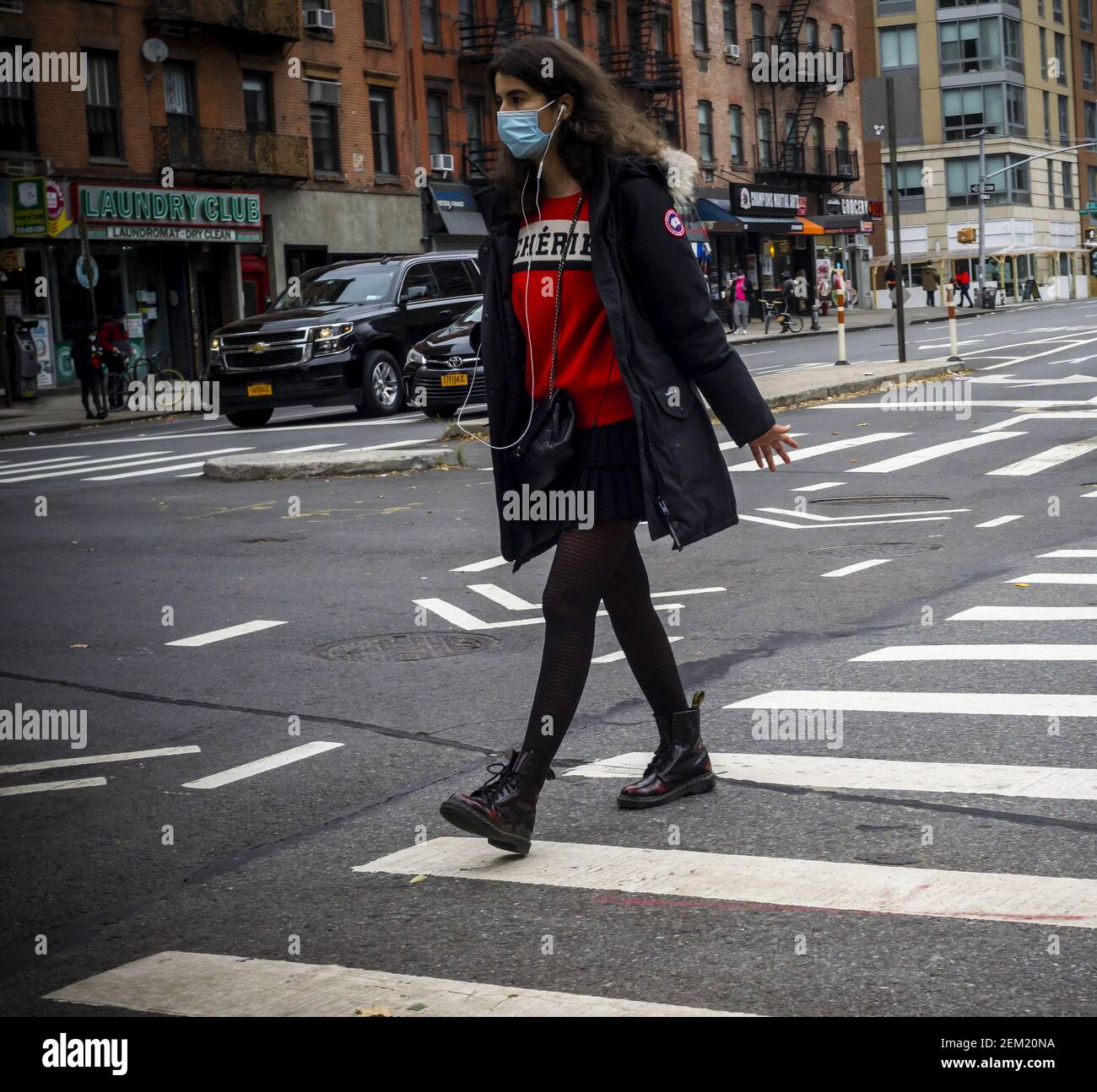 Masked pedestrian in Manhattan in New York on Sunday, November 22, 2020 ...