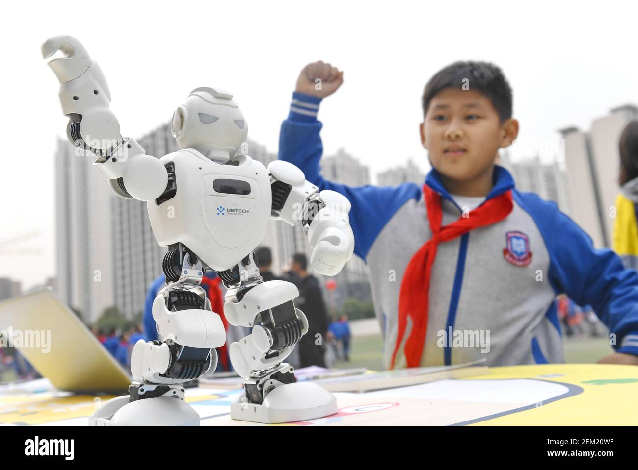 The students are watching the robots doing Tai Chi at the 6th science ...