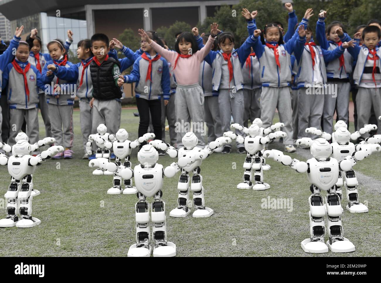 The students are watching the robots doing Tai Chi at the 6th science ...
